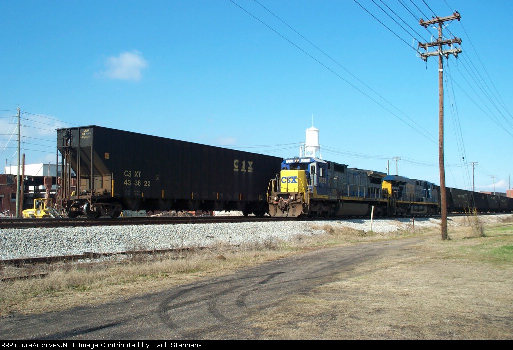 CSX 7633 leads A745 after running around its train in West Point in late Ganuary 2009. The chips ...